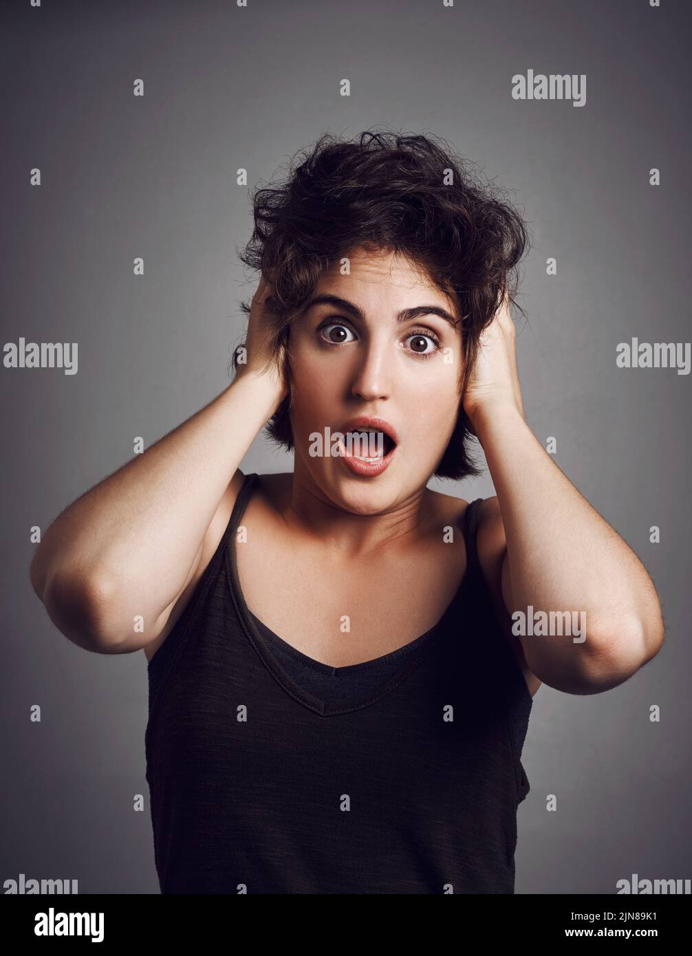 Thats a shocker. Studio portrait of an attractive young woman looking ...