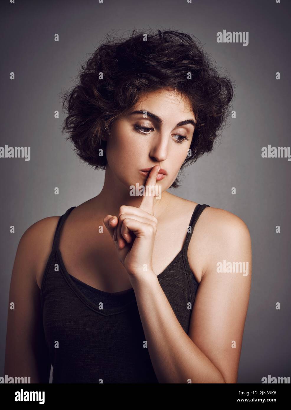 Finger over lips hi-res stock photography and images - Alamy