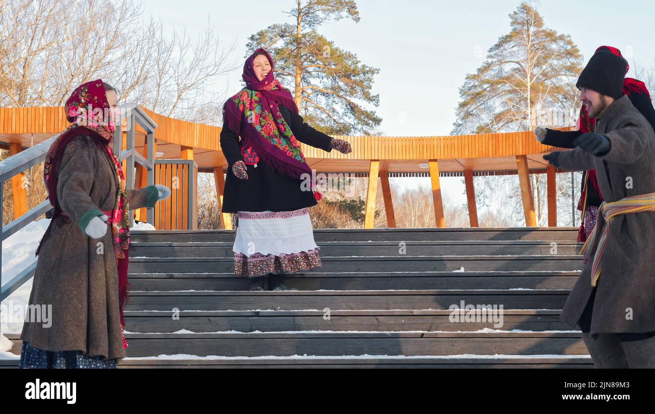 Russian folklore at ours time - young people in felt boots are dancing ...