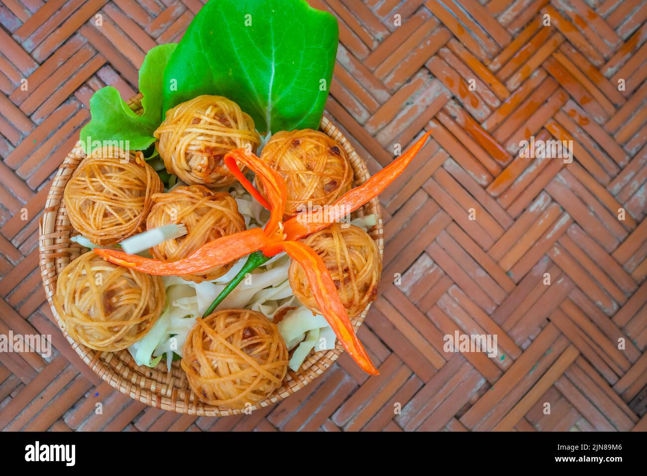 Deep fried wrapped pork with noodle. Traditional thai food as known as ...