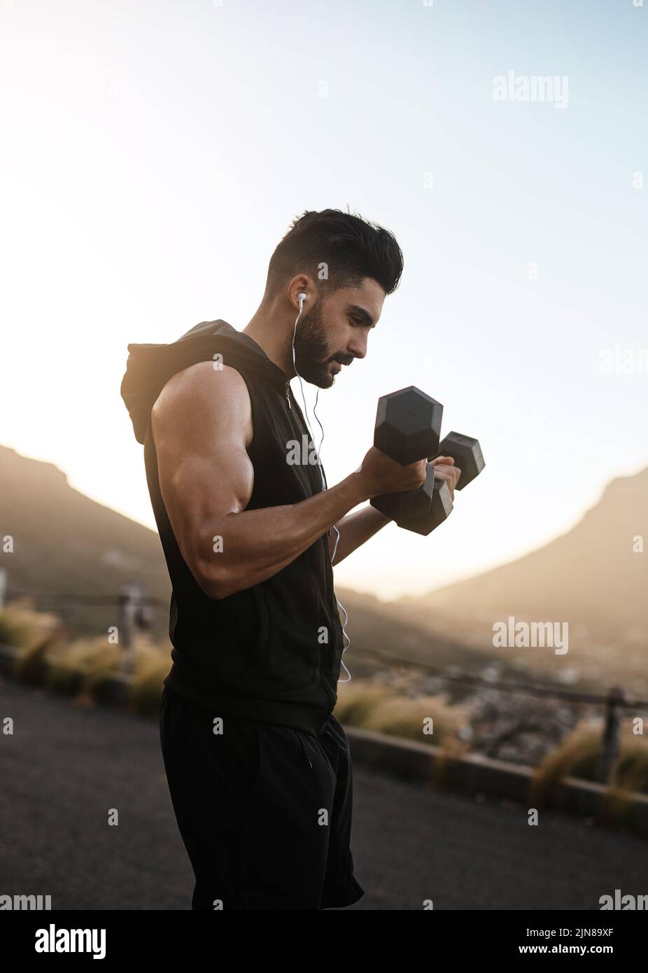 Bodies of steel are built with discipline. a sporty young man ...