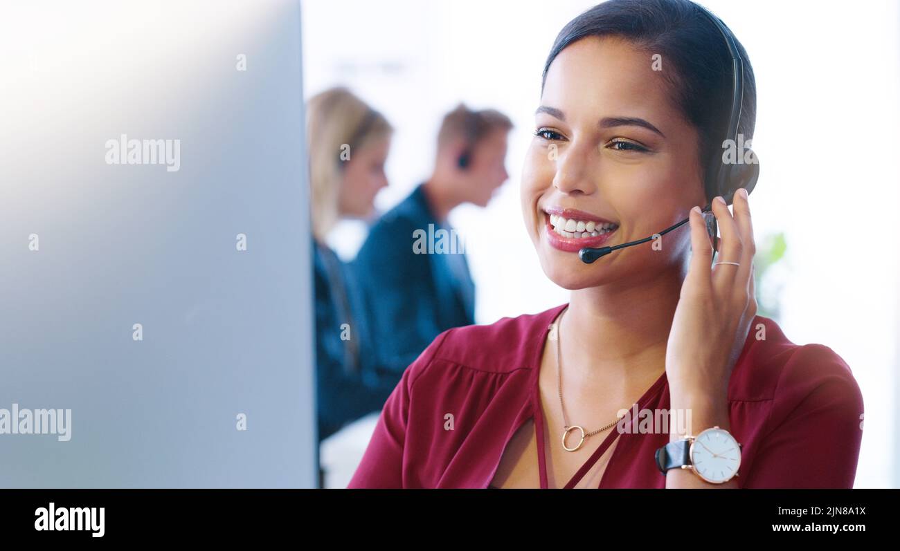 Customer service speaking. a cheerful young businesswoman wearing a ...