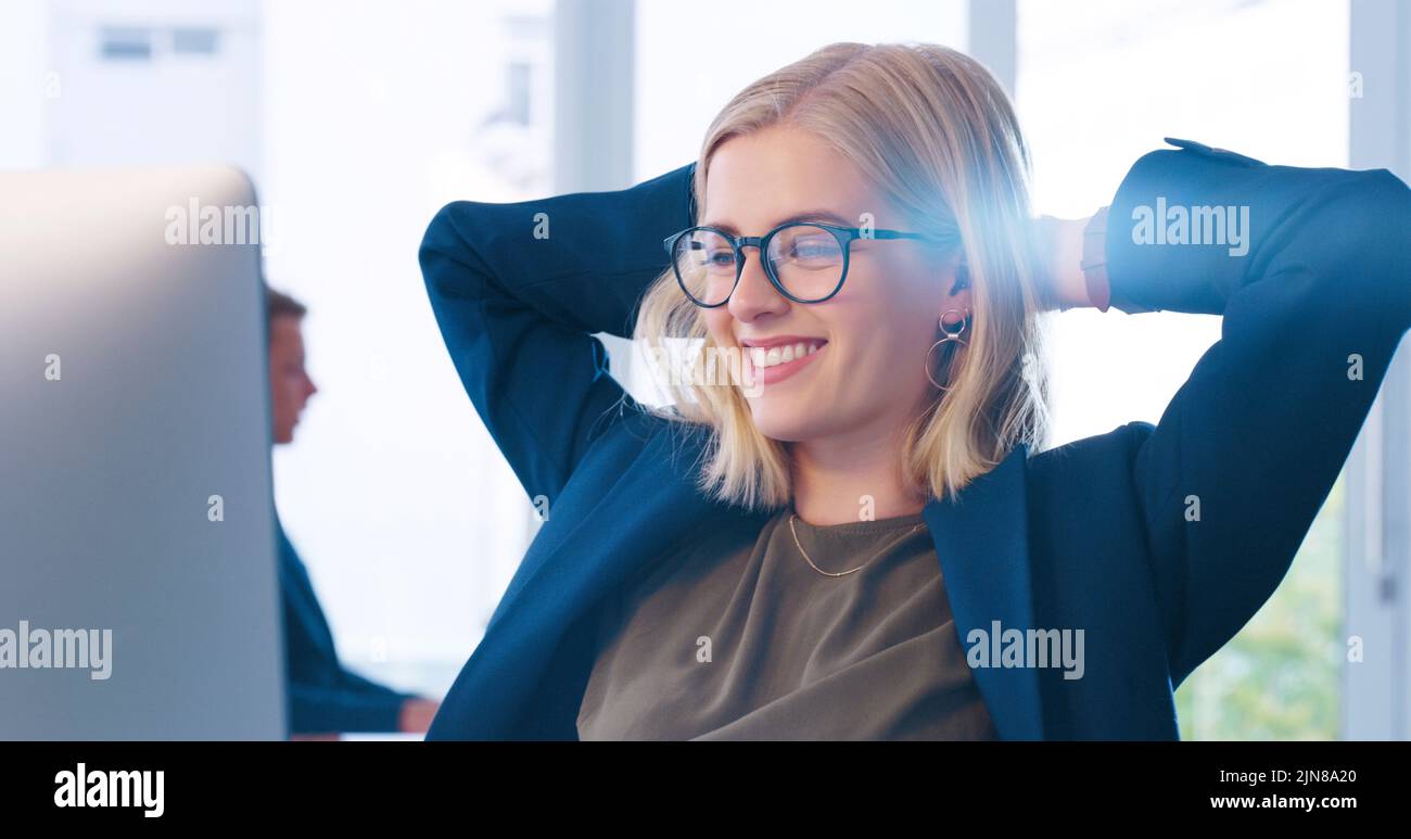 Sit back and enjoy the ride. a carefree young businesswoman sitting ...