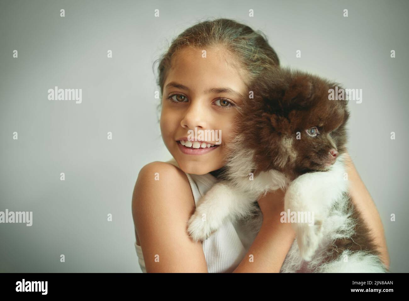 This is my adorable pup. a young girl posing with her puppy Stock Photo ...