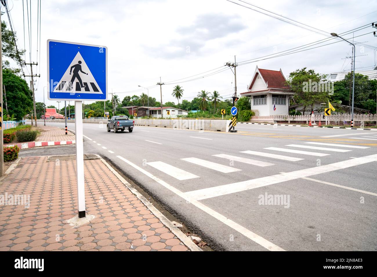 Zebra cross sign beside the road at Thailand Stock Photo - Alamy