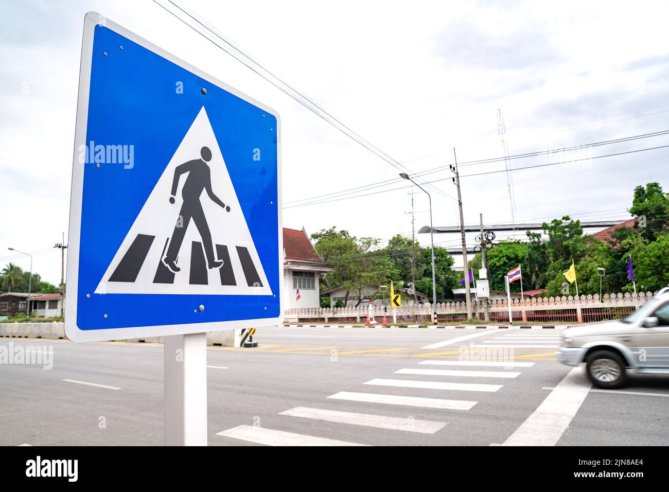 Zebra cross sign beside the road at Thailand Stock Photo - Alamy