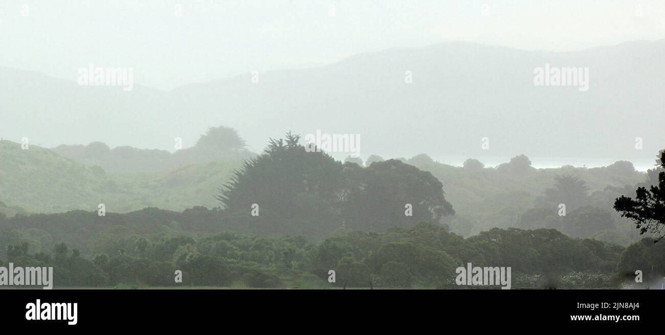 Farm landscape in rain Stock Photo - Alamy