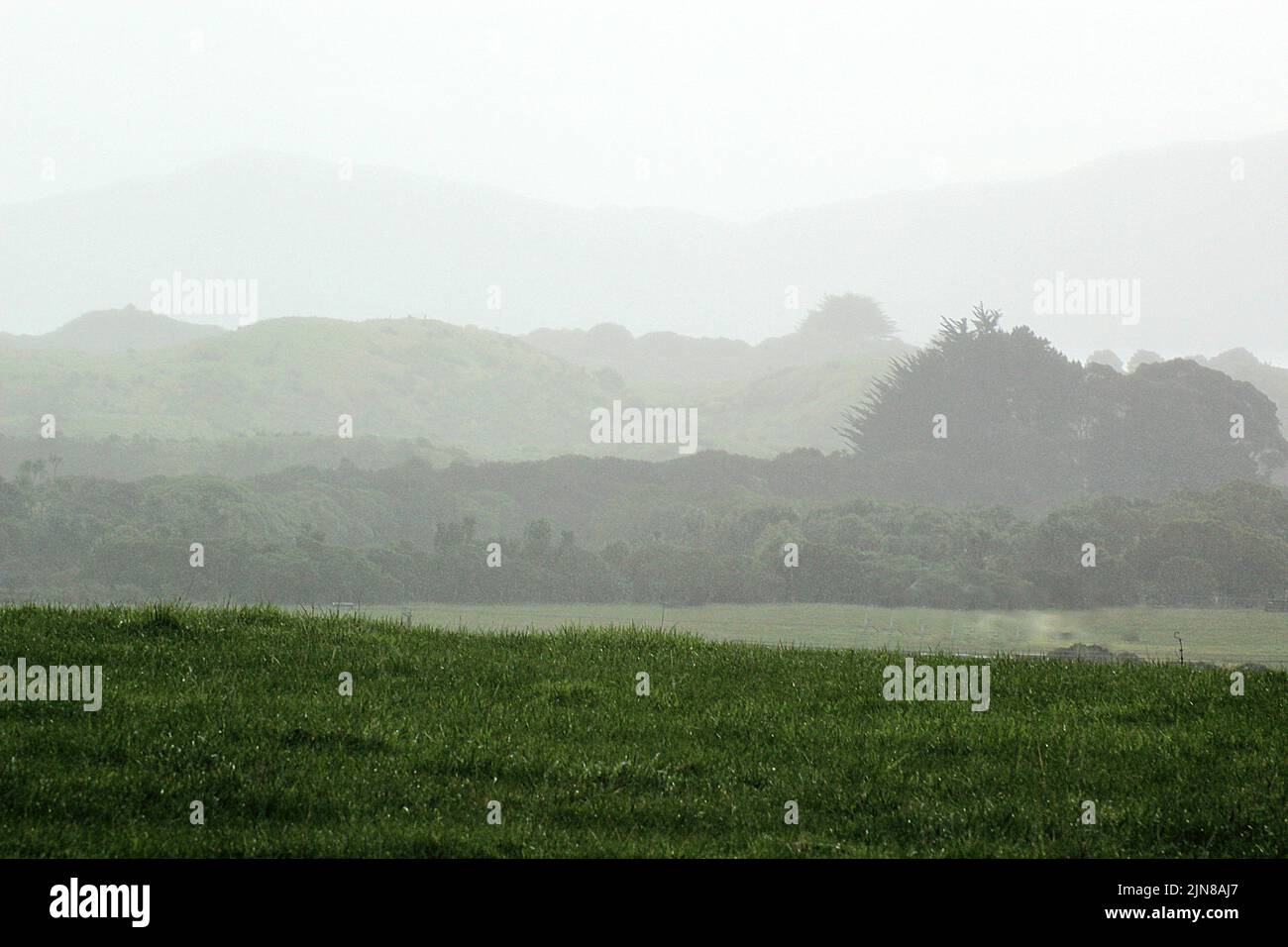 Farm landscape in rain Stock Photo - Alamy