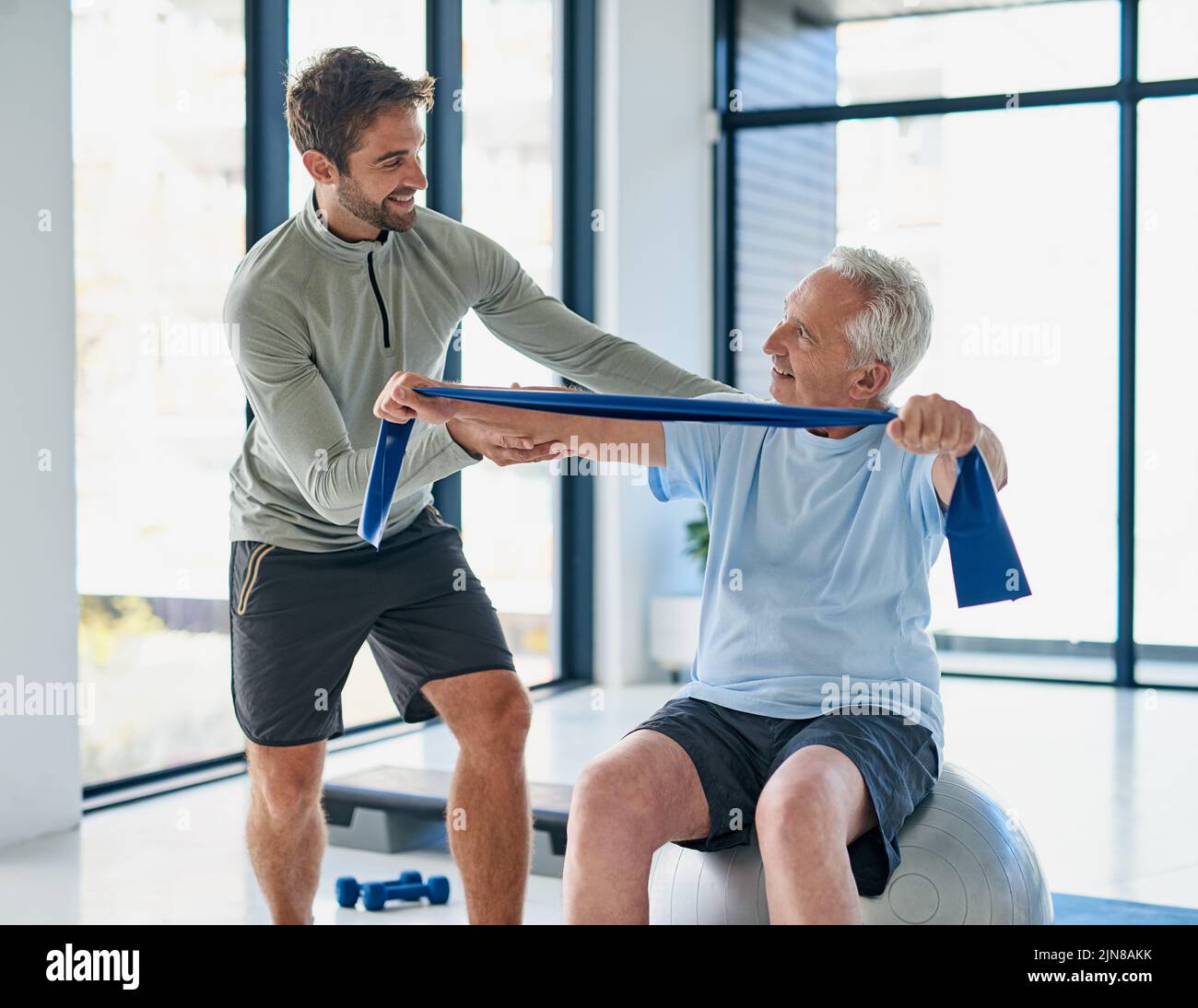 Stretch a band two people hi-res stock photography and images - Alamy