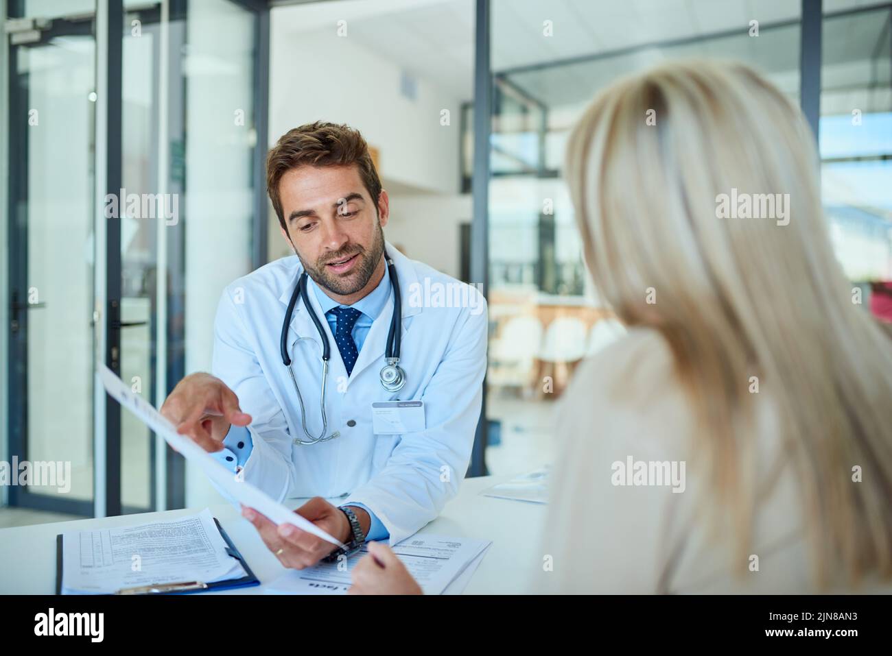 The tests show youre actually in great health. a handsome doctor going ...