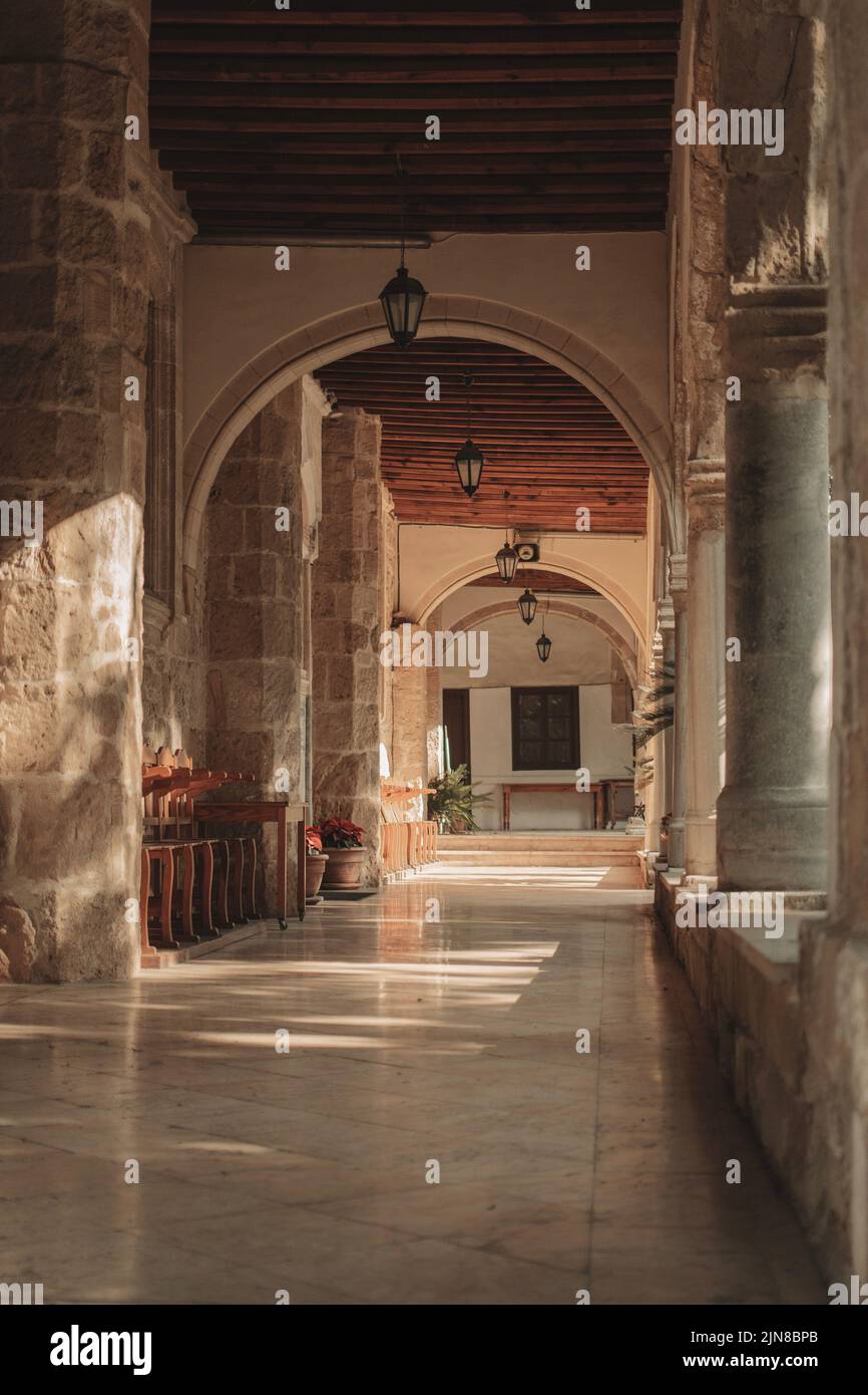 Beautiful arch with lanterns and potted plants in church Stock Photo ...