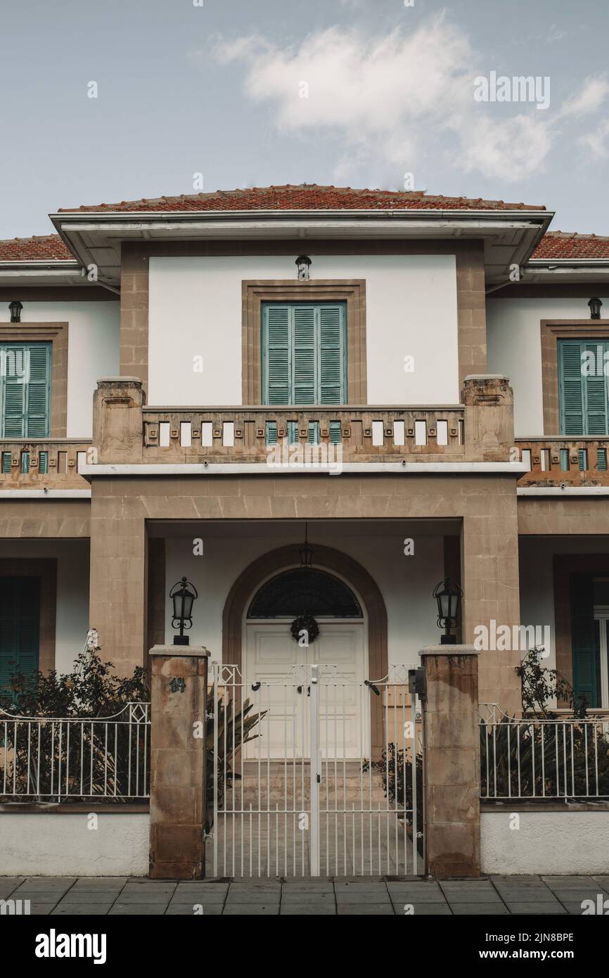Modern building with columns, balcony and tropical plants in Larnaca ...