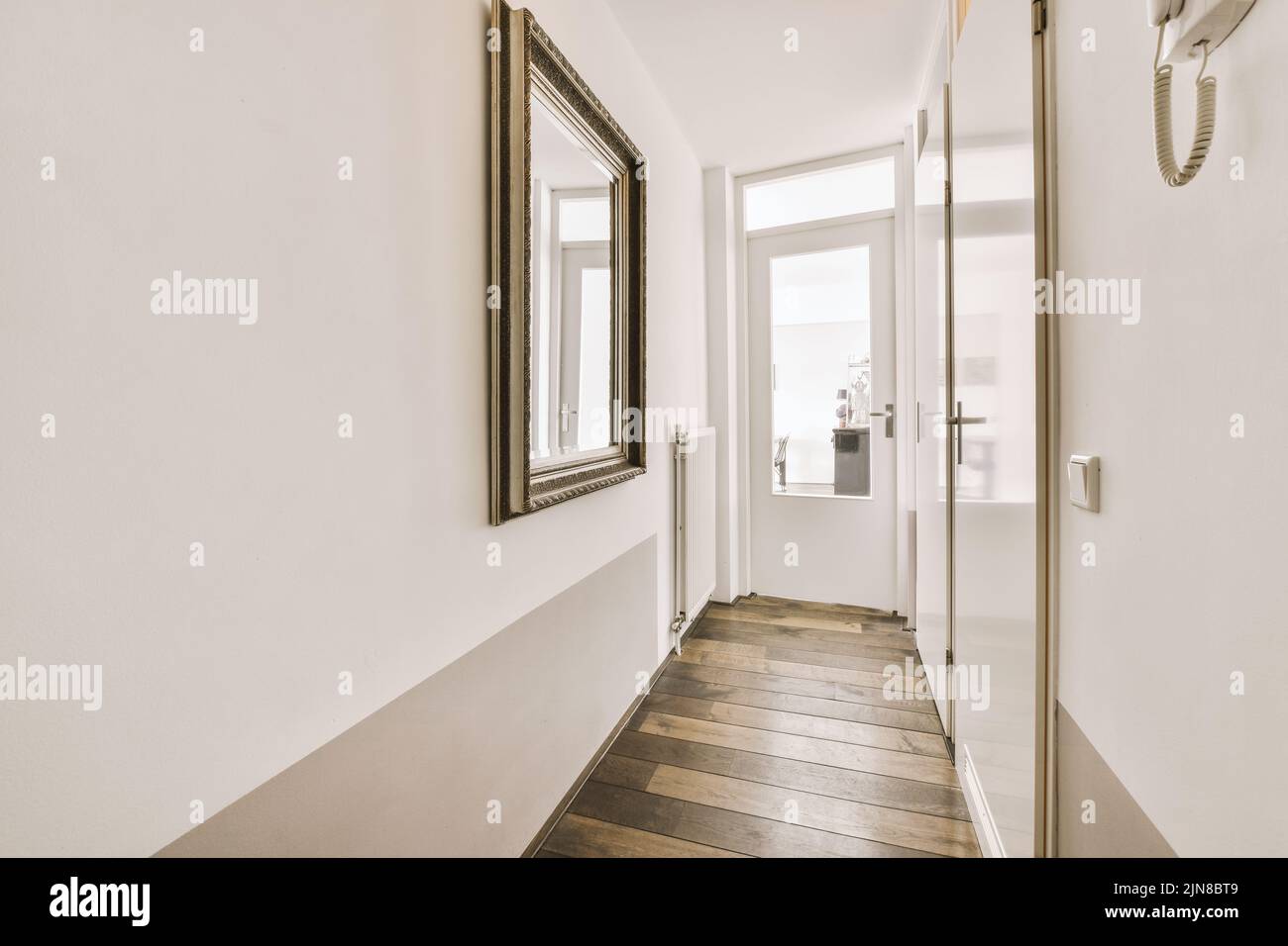 Light narrow hallway with many doors in white walls and glowing lamp ...