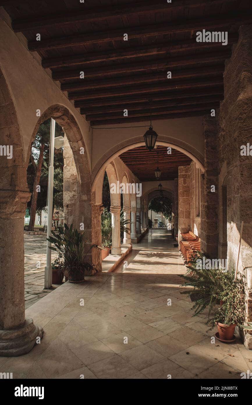 Beautiful arch with lanterns and potted plants in church Stock Photo ...