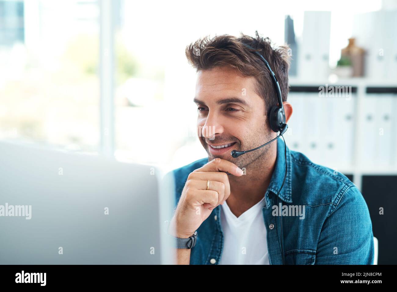 He has a solution for everything. an attractive young call centre agent ...