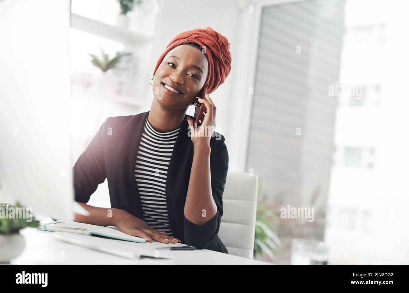 Attractive young business women calling by cellular phone isolated on ...