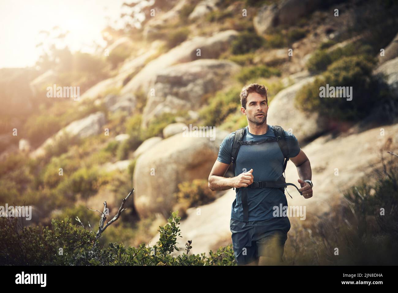 Guy running through mountain hi-res stock photography and images - Alamy