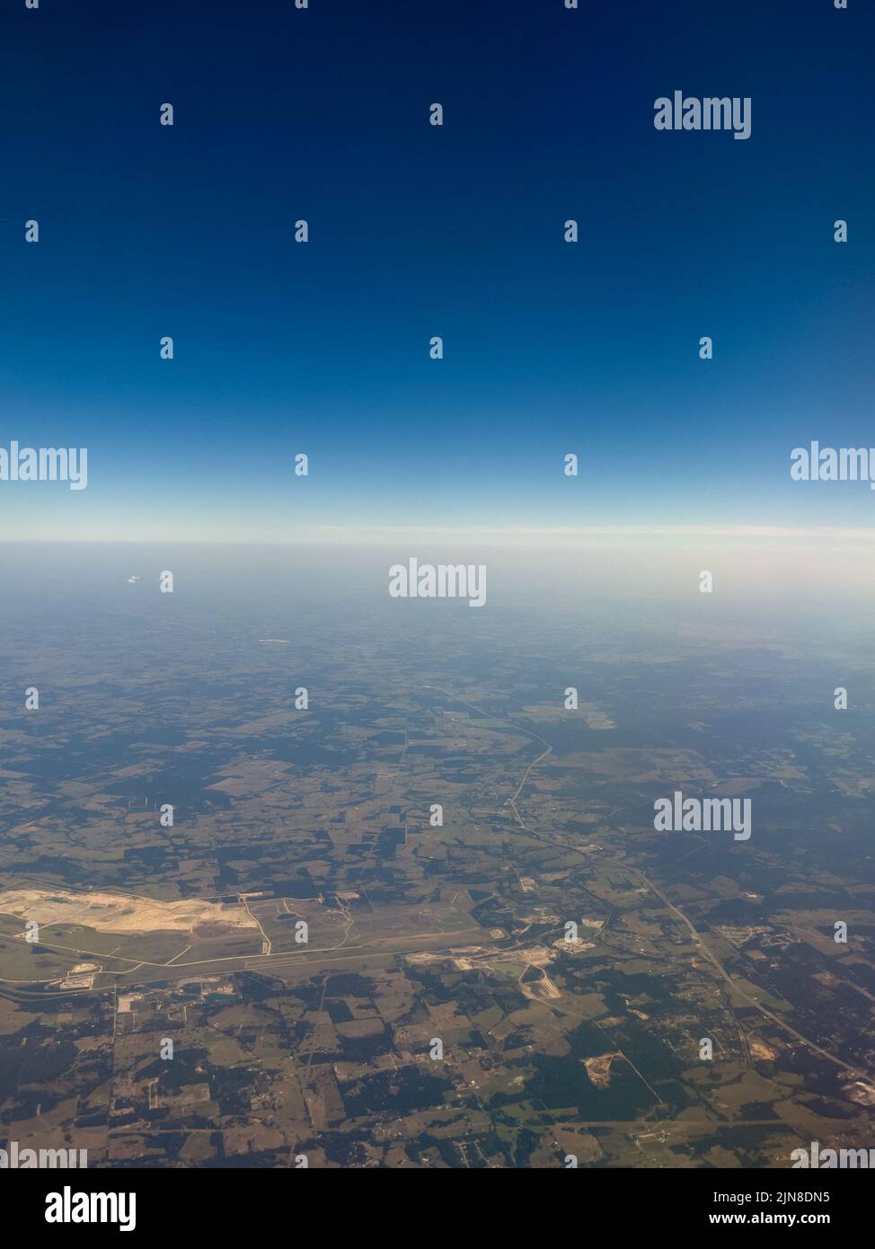 The vertical aerial view of the landscape under the blue sky Stock ...
