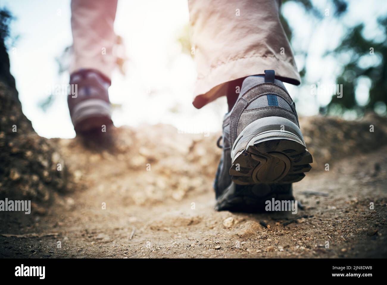 Keep moving to reach the top. Low angle shot of an unrecognizable man ...