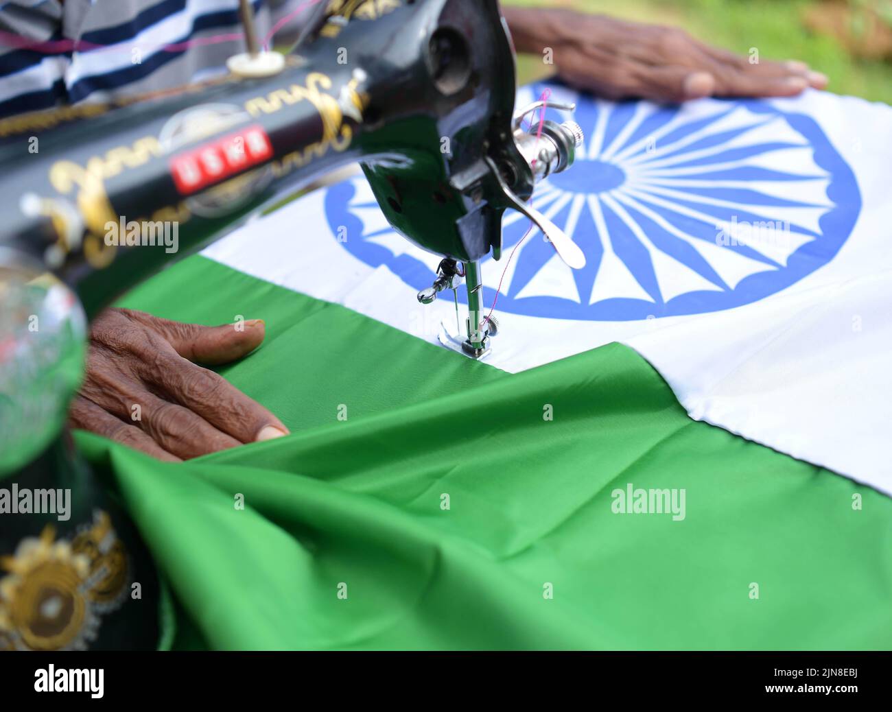 Workers prepare Indian national flags at a workshop ahead of India’s ...