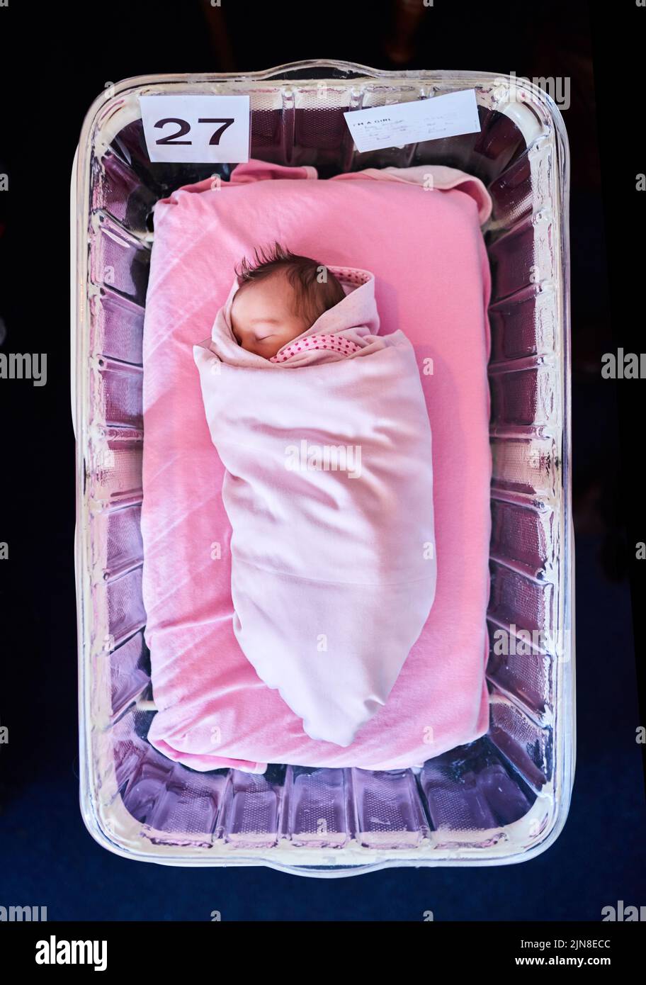 Shes stuck in dream land. High angle shot of a newly born baby girl ...