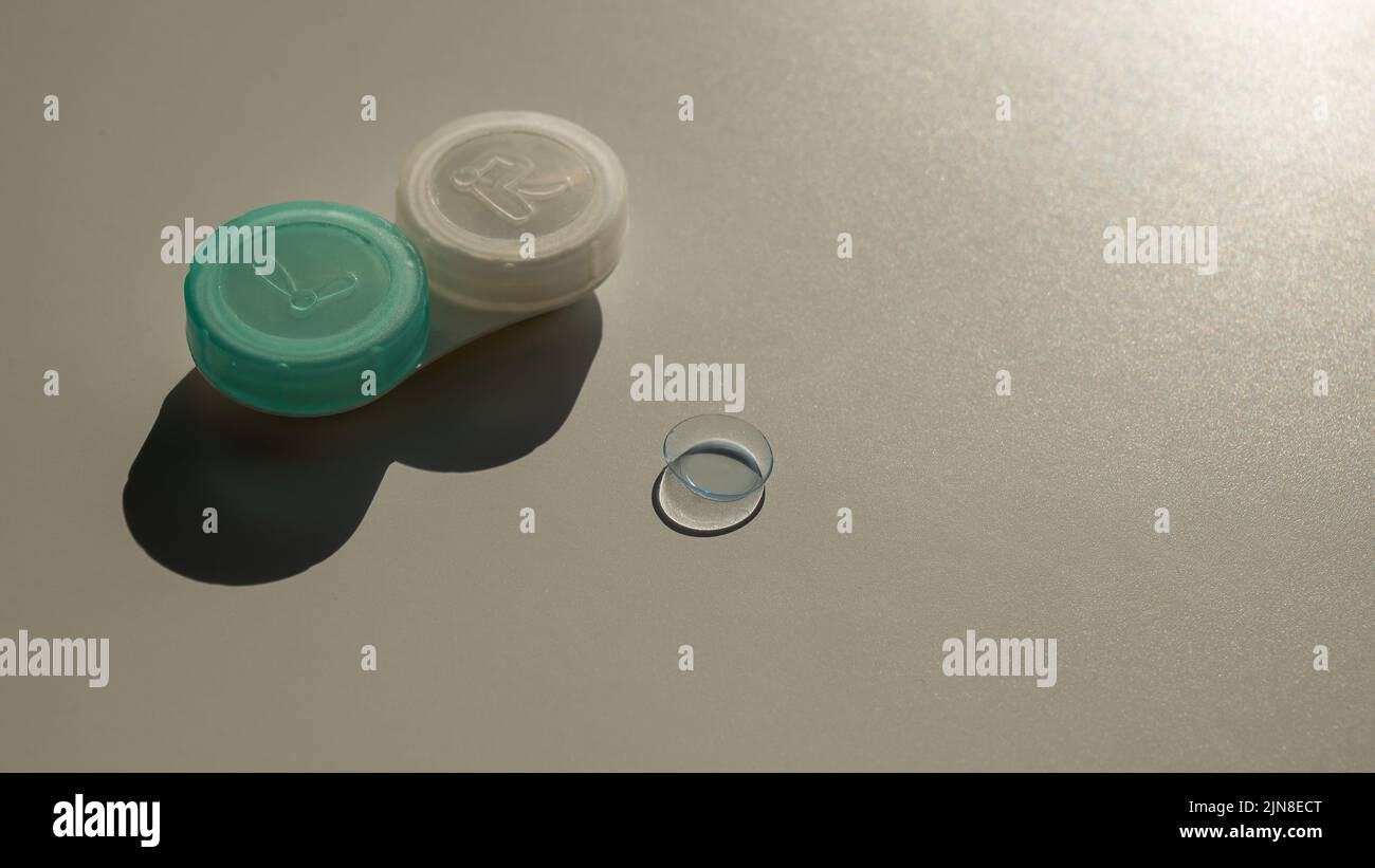 Contact lenses and a storage container on a white table Stock Photo - Alamy