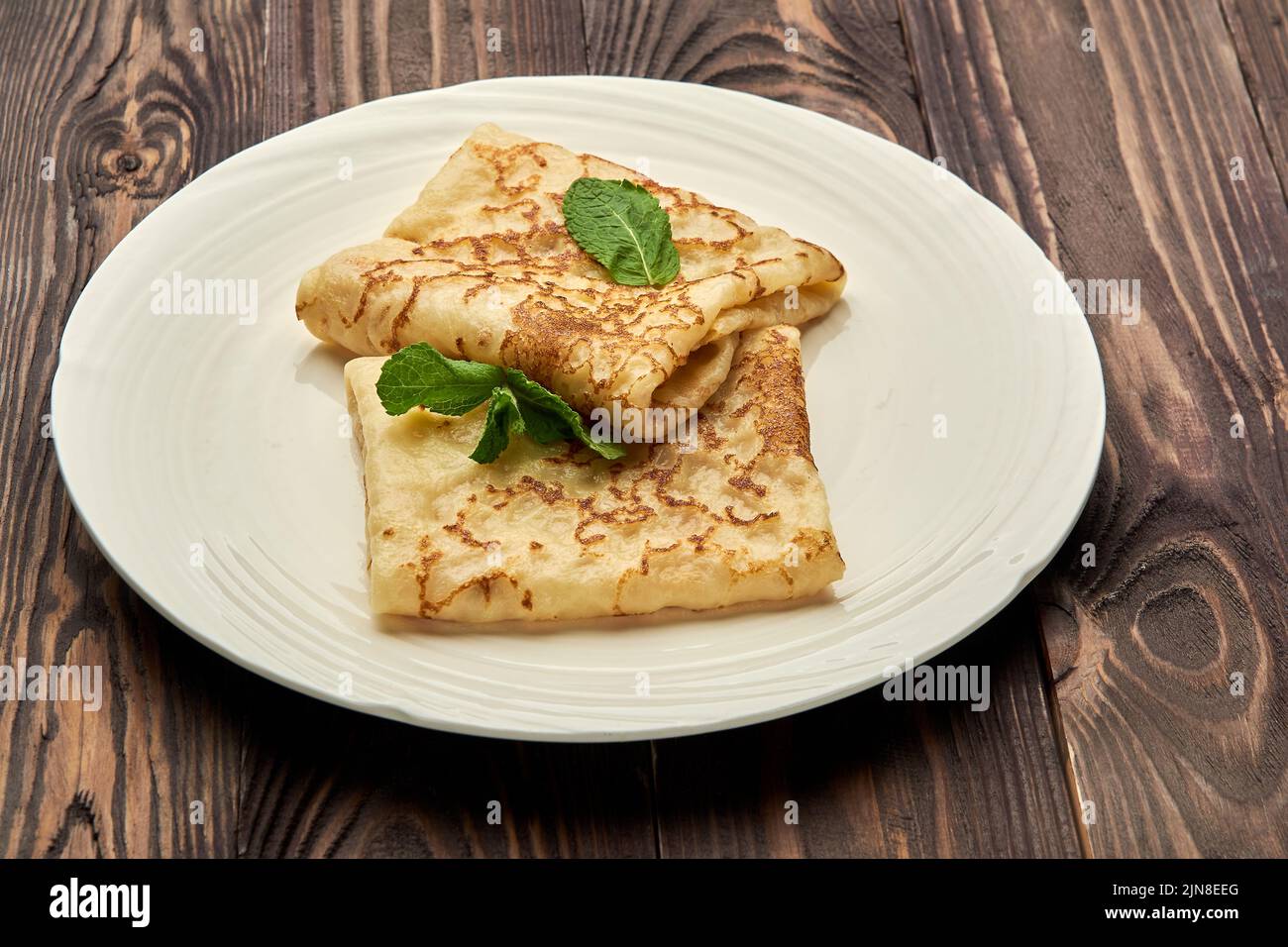 delicious juicy pancakes lie on a white plate Stock Photo - Alamy