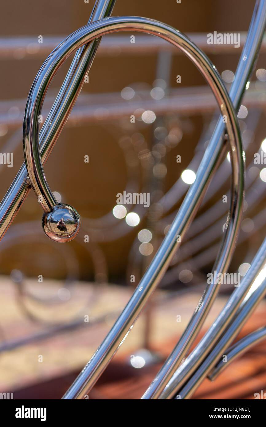 Decorative railing made of stainless metal close-up. Vertical photo ...