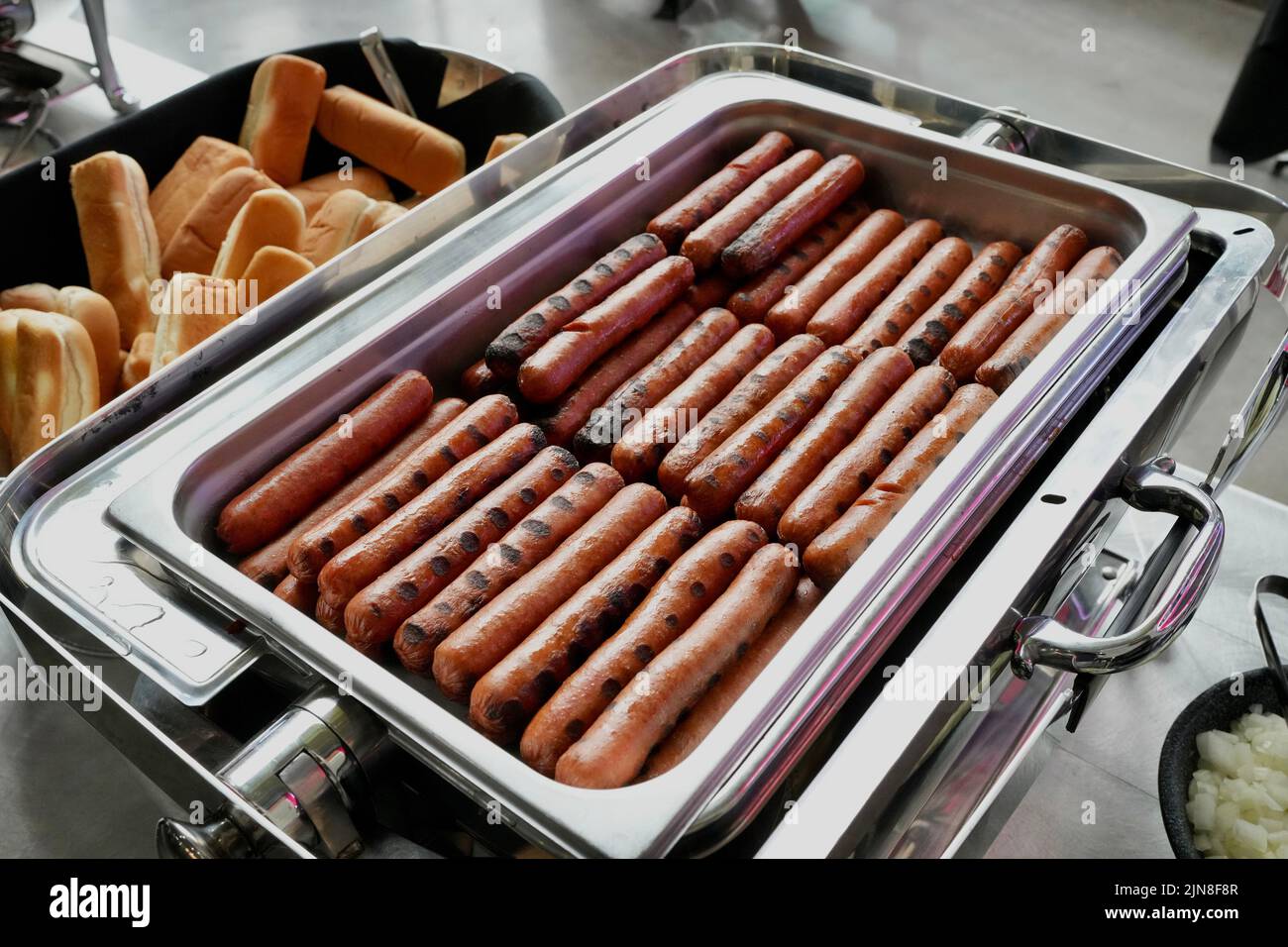 A group of hot dogs in a tray at a buffet Stock Photo - Alamy