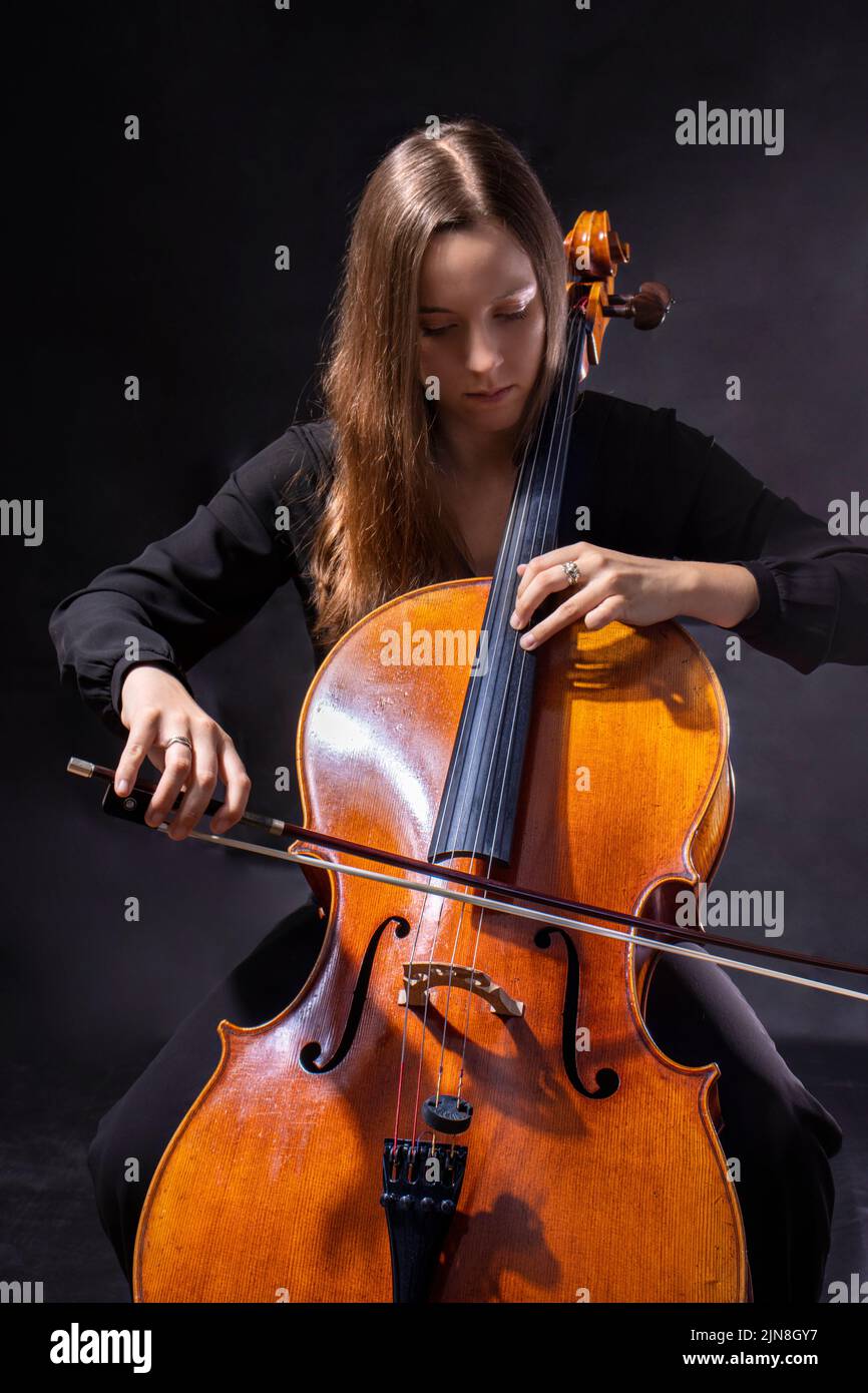 Girl playing cello hi-res stock photography and images - Alamy