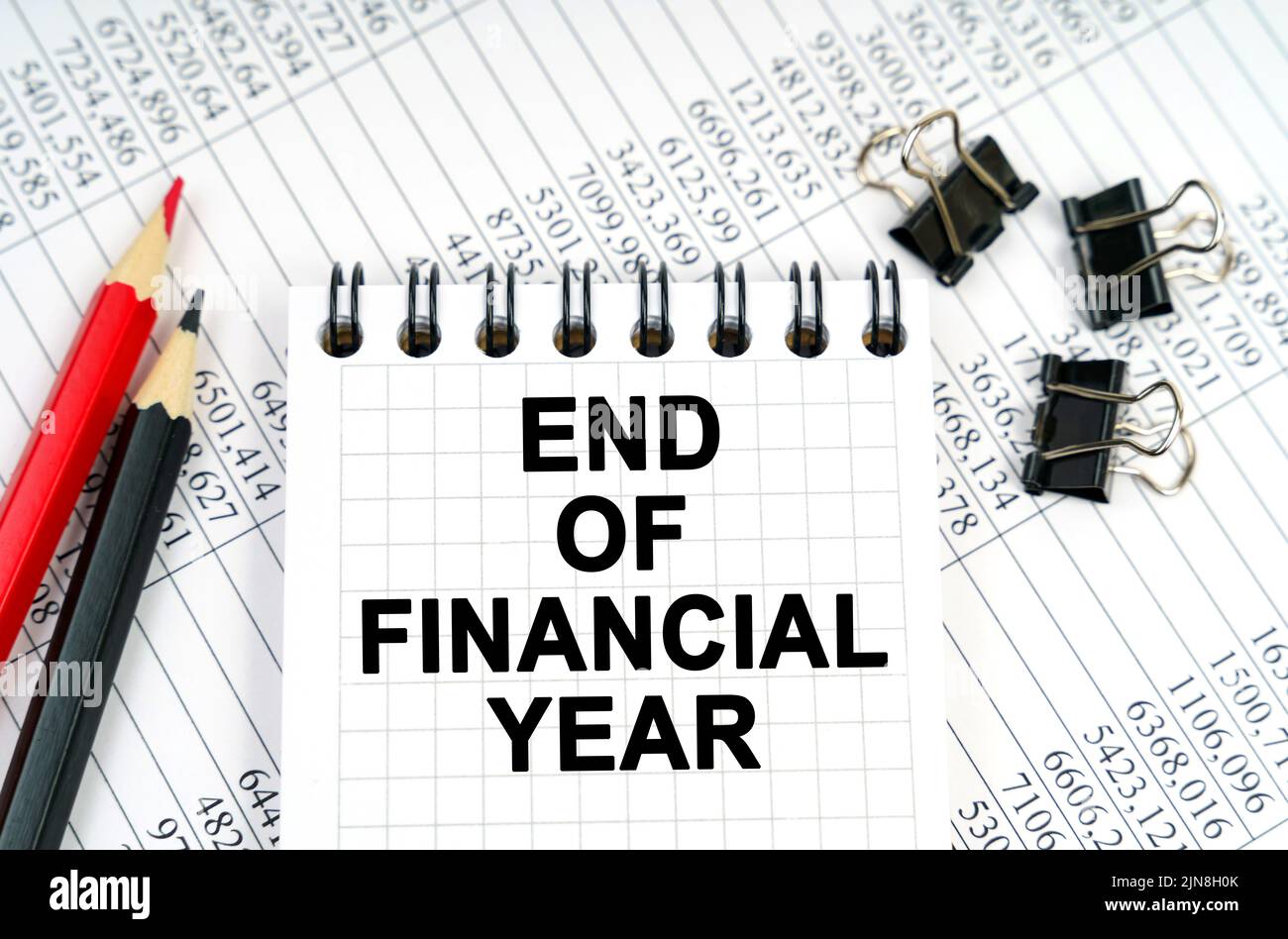 Economy and business concept. On the table are reports, pencils and a ...