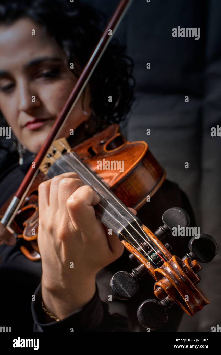 Beautiful girl professional violinist playing antique violin Stock ...