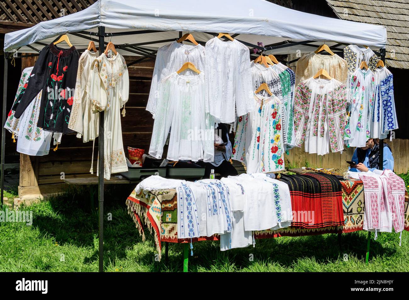 Traditional Romanian hand made clothes displayed for sale at a hand ...