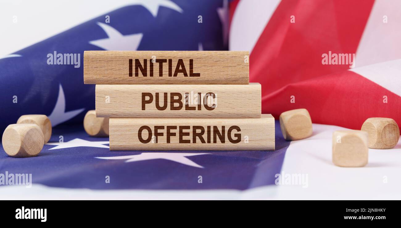 Business concept. The American flag has wooden cubes and plaques that ...