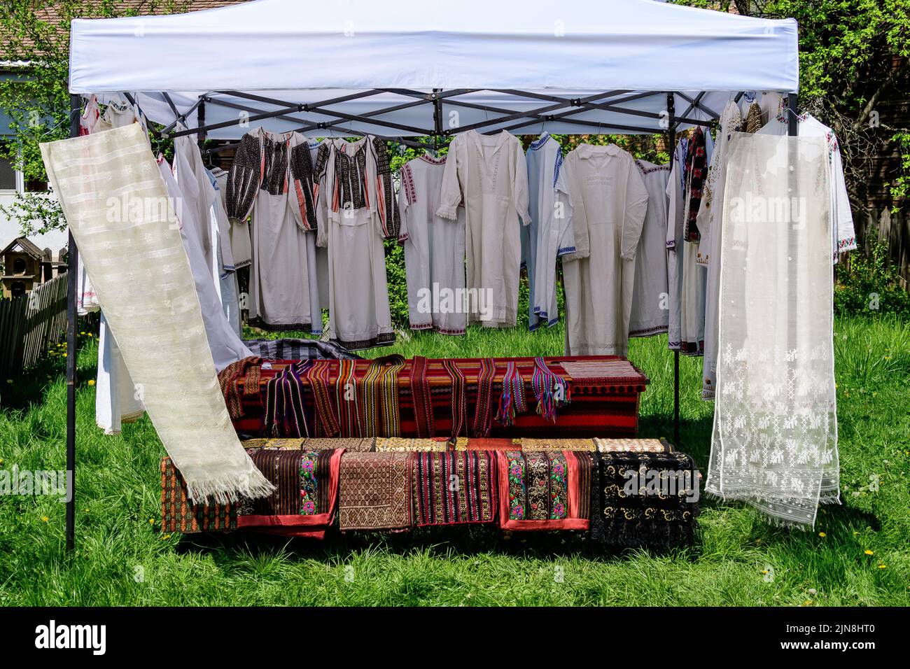 Traditional Romanian hand made clothes displayed for sale at a hand ...
