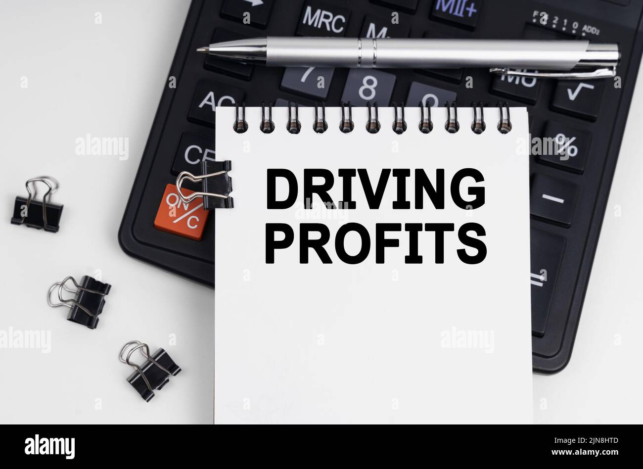 Business and economics concept. On the table is a calculator, a pen and ...