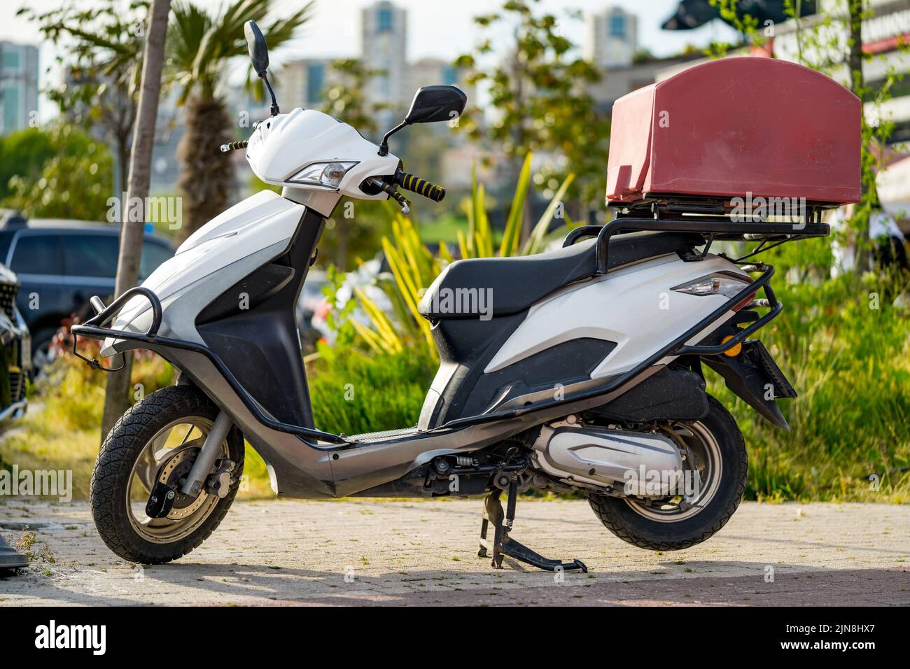 Food delivery motorbike with isothermal box parked on street Stock ...