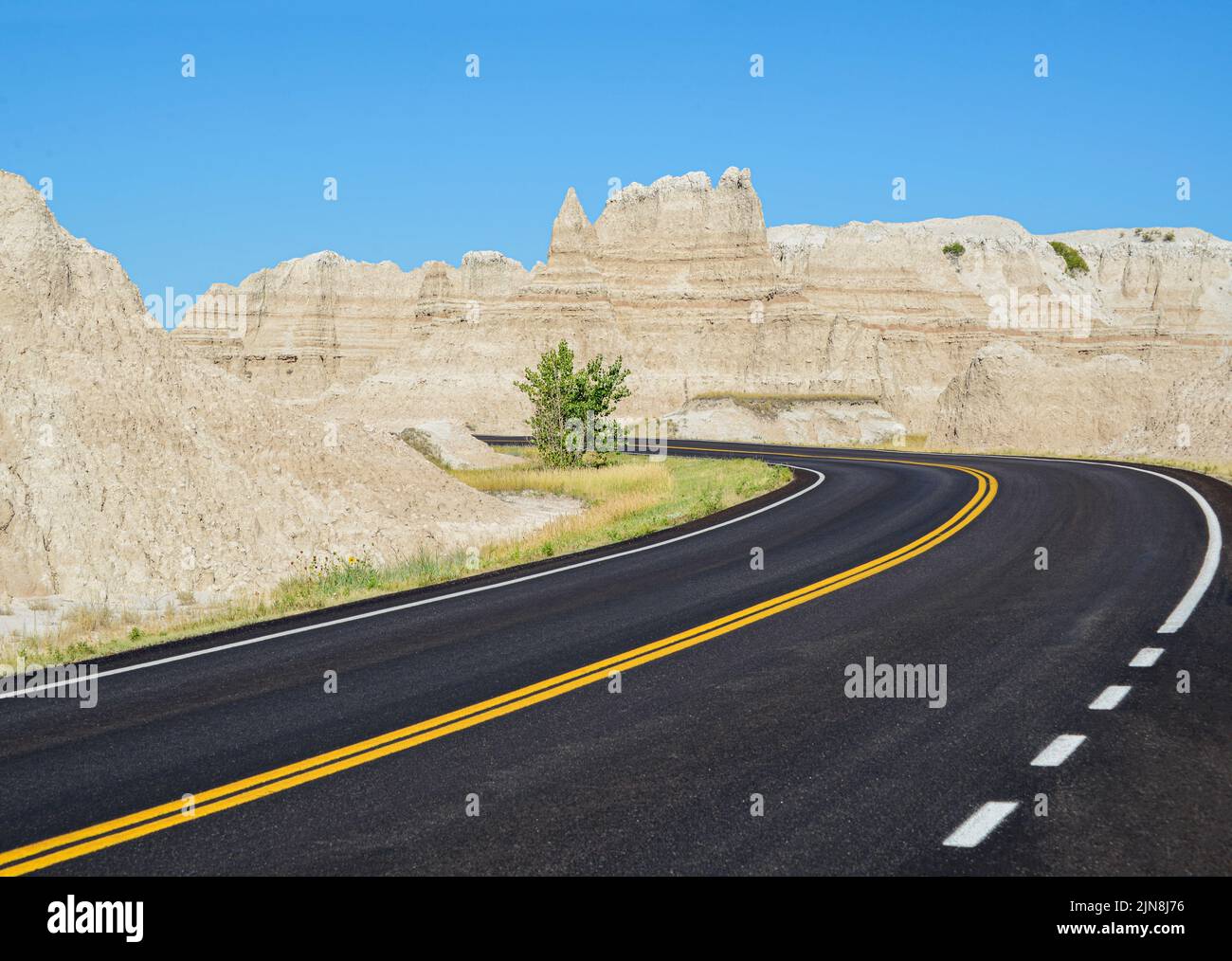 Isolated road through Badlands National Park in South Dakota Stock ...