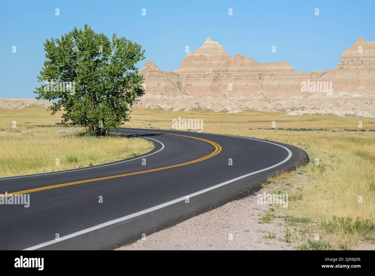 Isolated road through Badlands National Park in South Dakota Stock Photo - Alamy