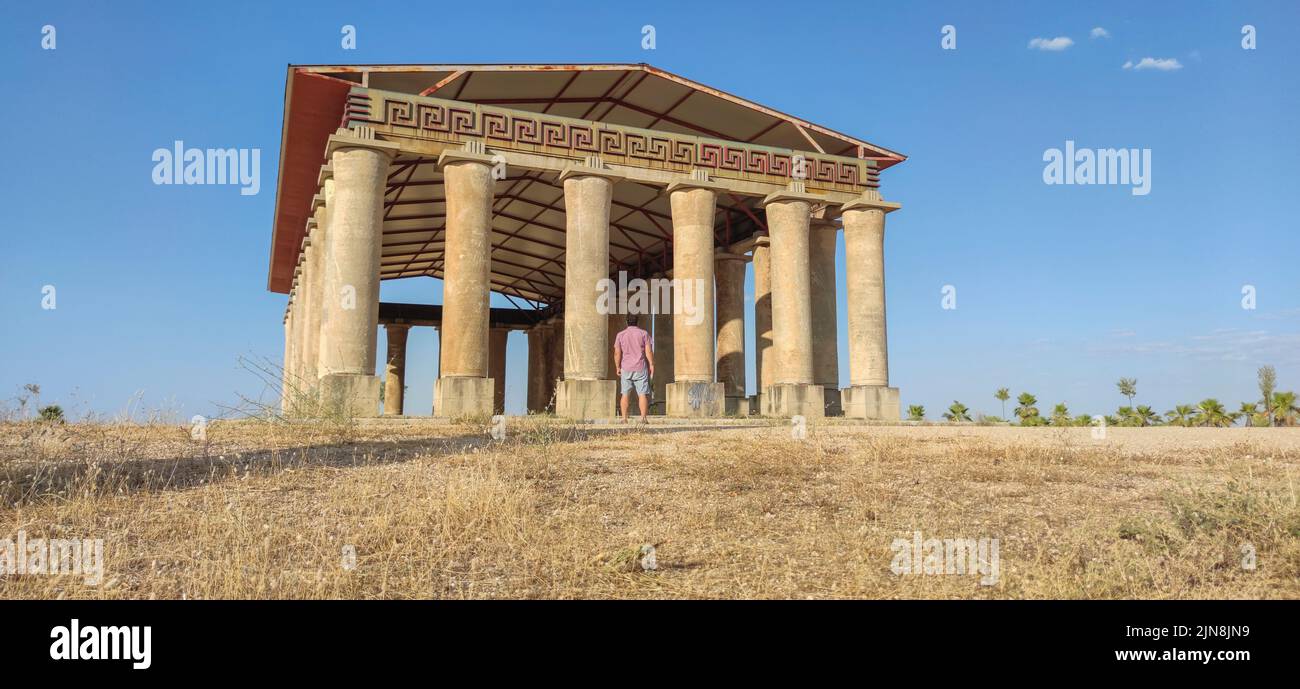 Visitor observing Parthenon replica built with recycled building ...