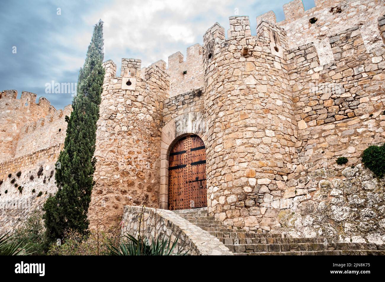Wall of the medieval castle of Villena in Spain Stock Photo - Alamy