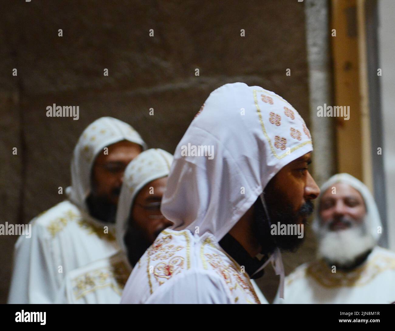 Coptic priests by the Coptic chapel in the back side of the Aedicule inside the church of the ...