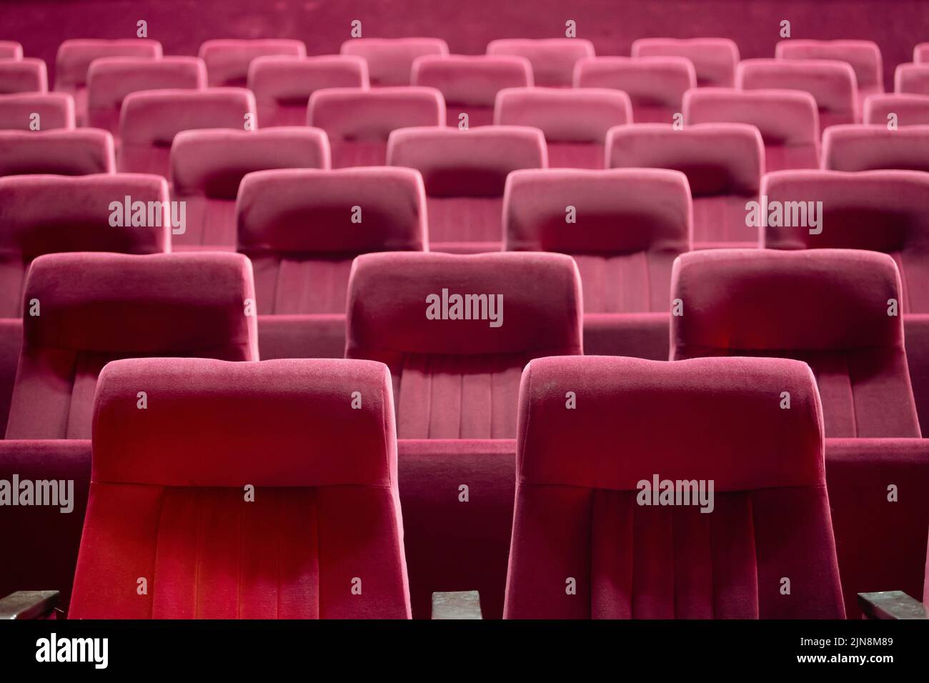 Empty cinema hall with red seats. Movie theatre Stock Photo - Alamy