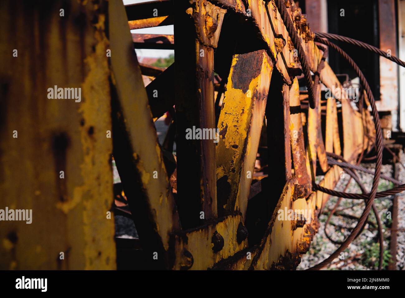 Iron bridge frame and bolt and bicycle. Yellow and rusty abandoned ...