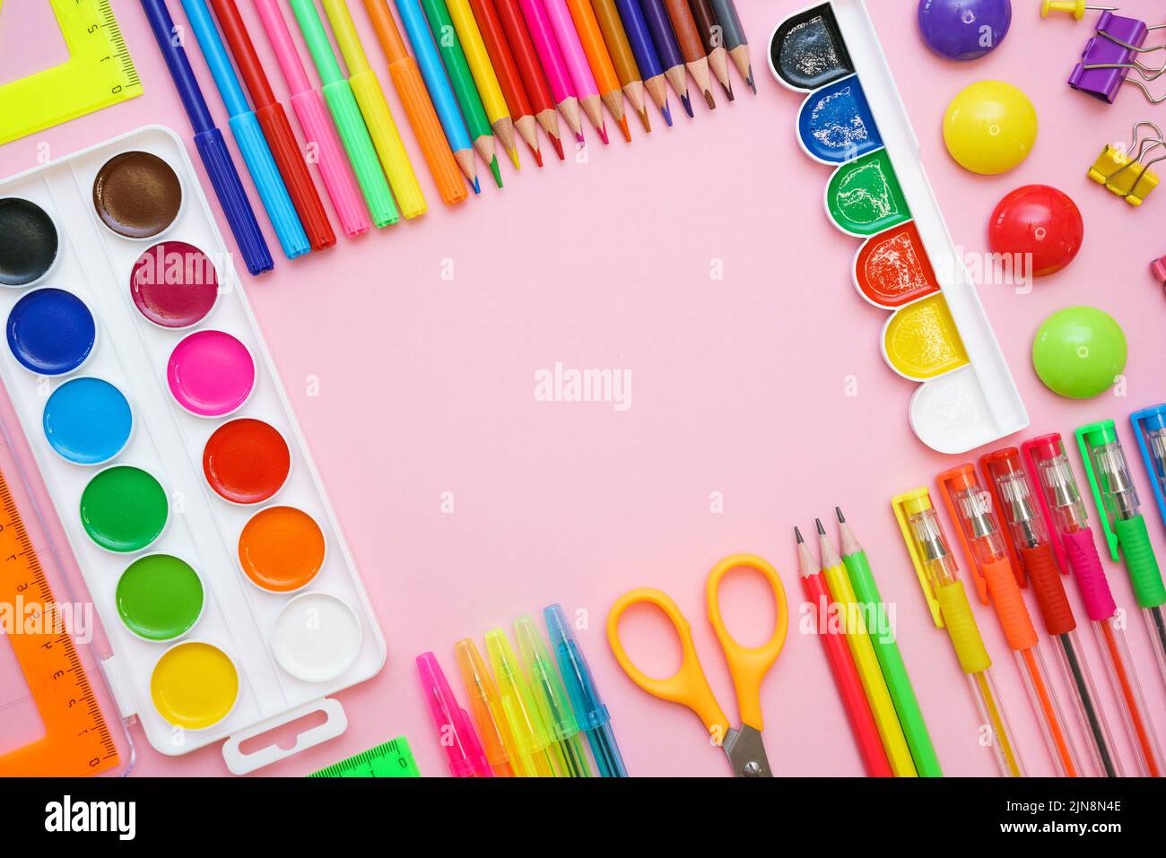School supplies, colored pencils, watercolor paints, pens, ruler and ...
