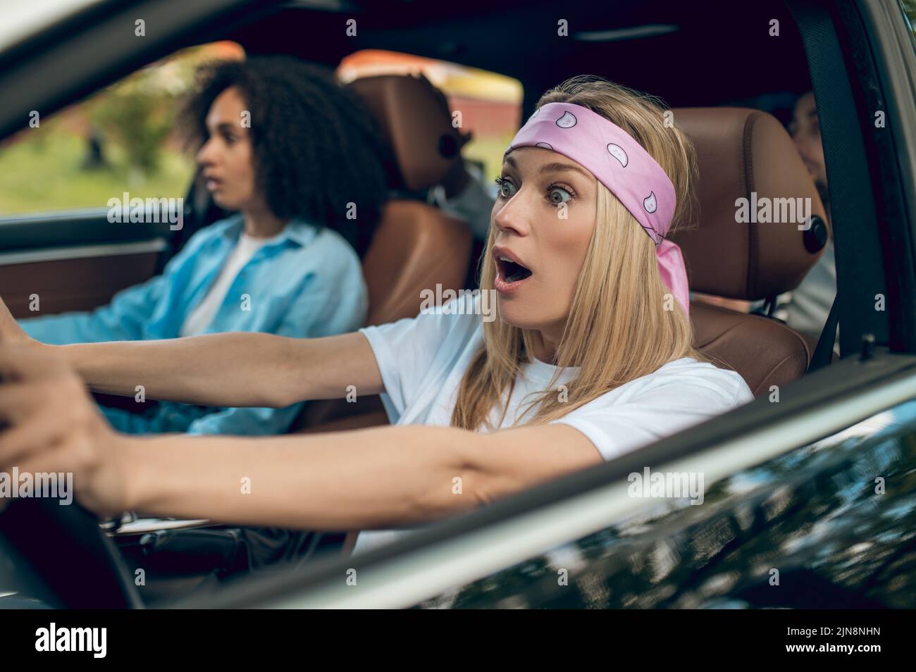 Girls in the car having car accident and looking scared Stock Photo - Alamy