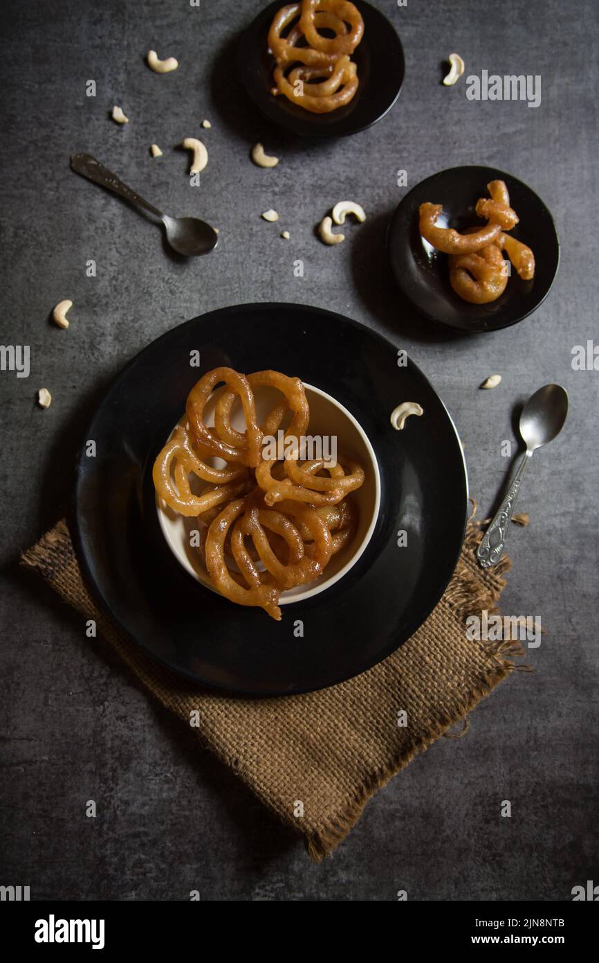 Indian sweet pieces of jalebi or imarti served Stock Photo - Alamy