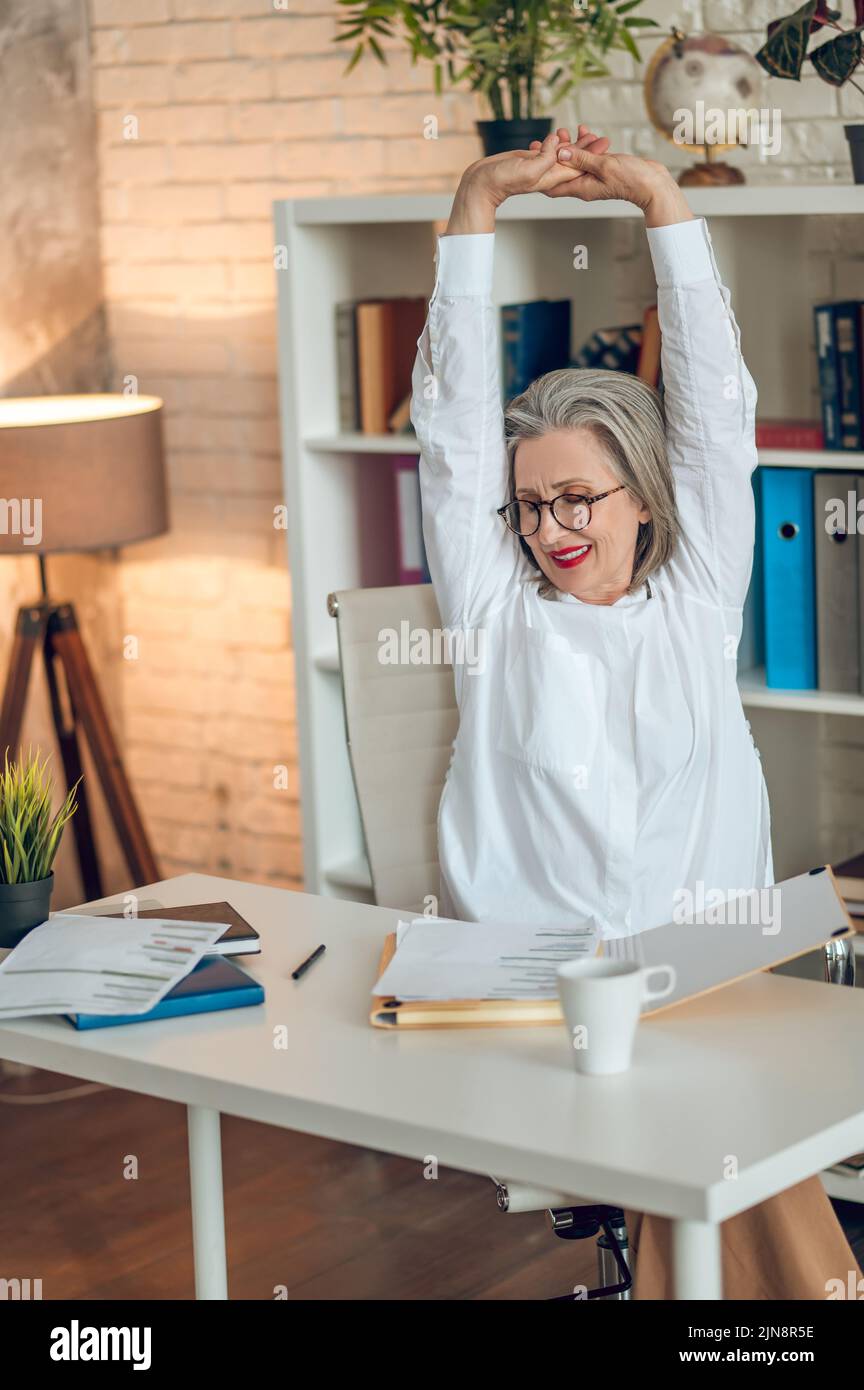 Tired woman in 50s working hi-res stock photography and images - Alamy