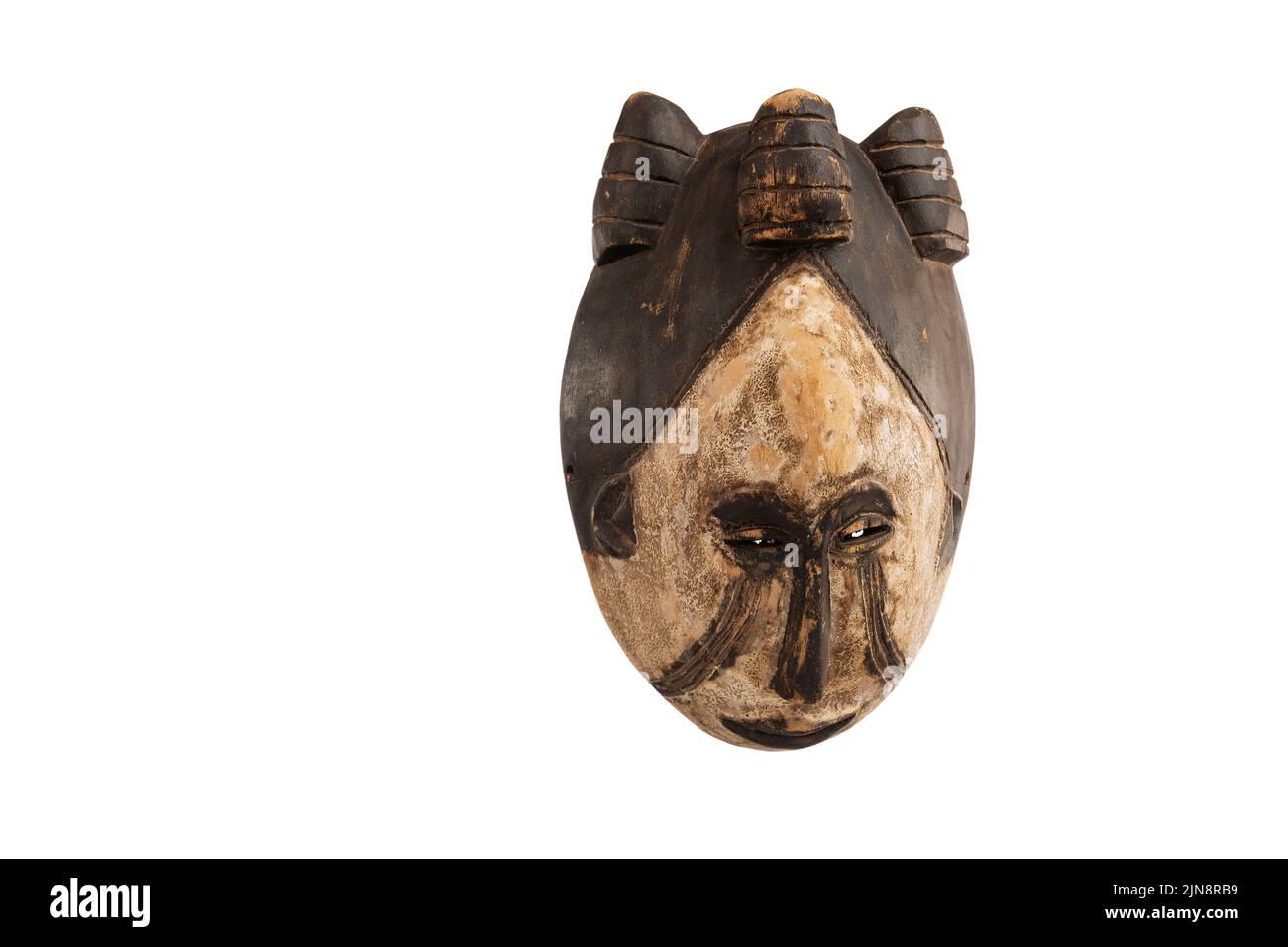 Traditional African wooden mask on a white background Stock Photo - Alamy
