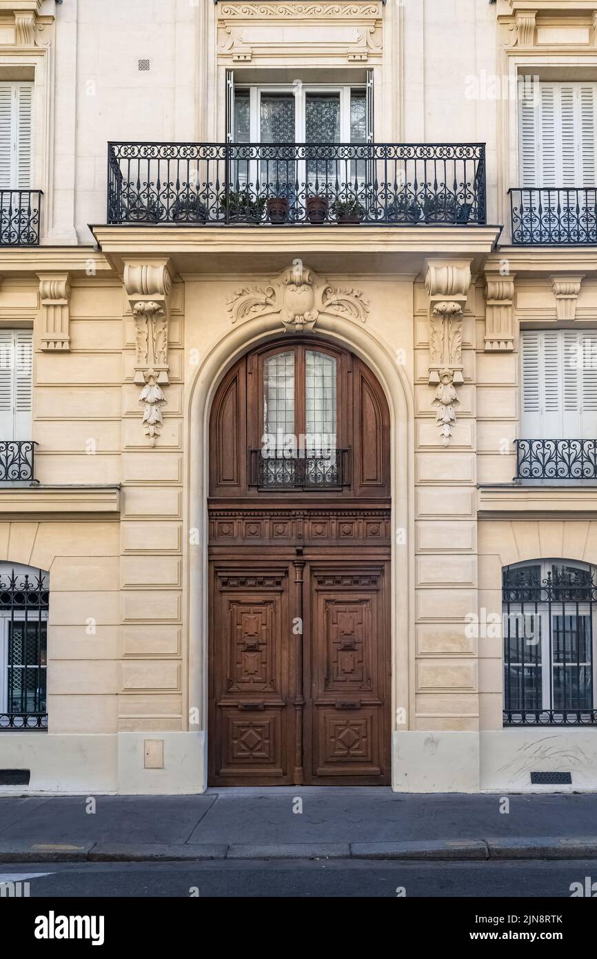 Paris, an ancient door, typical building in the 11e arrondissement ...